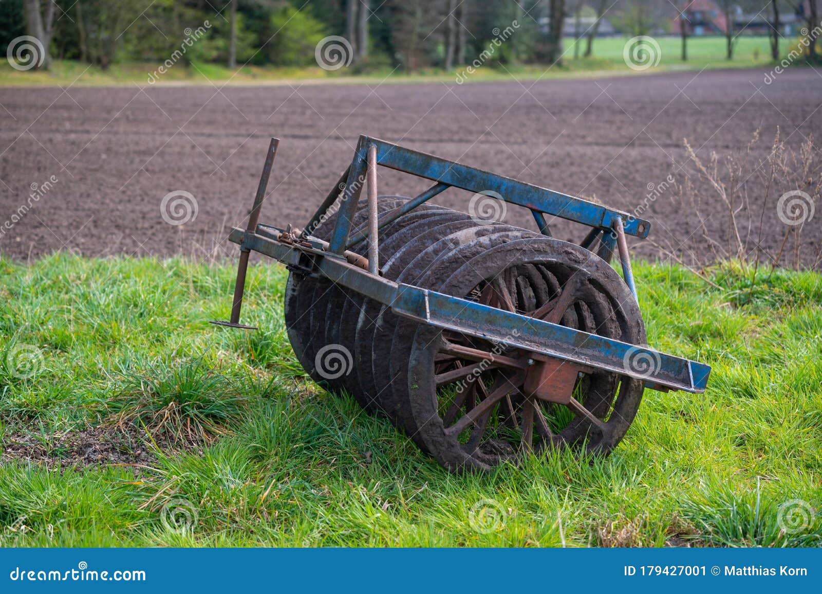 An Old Farm Implement Stands in Front of a Plowed Field Stock Image ...