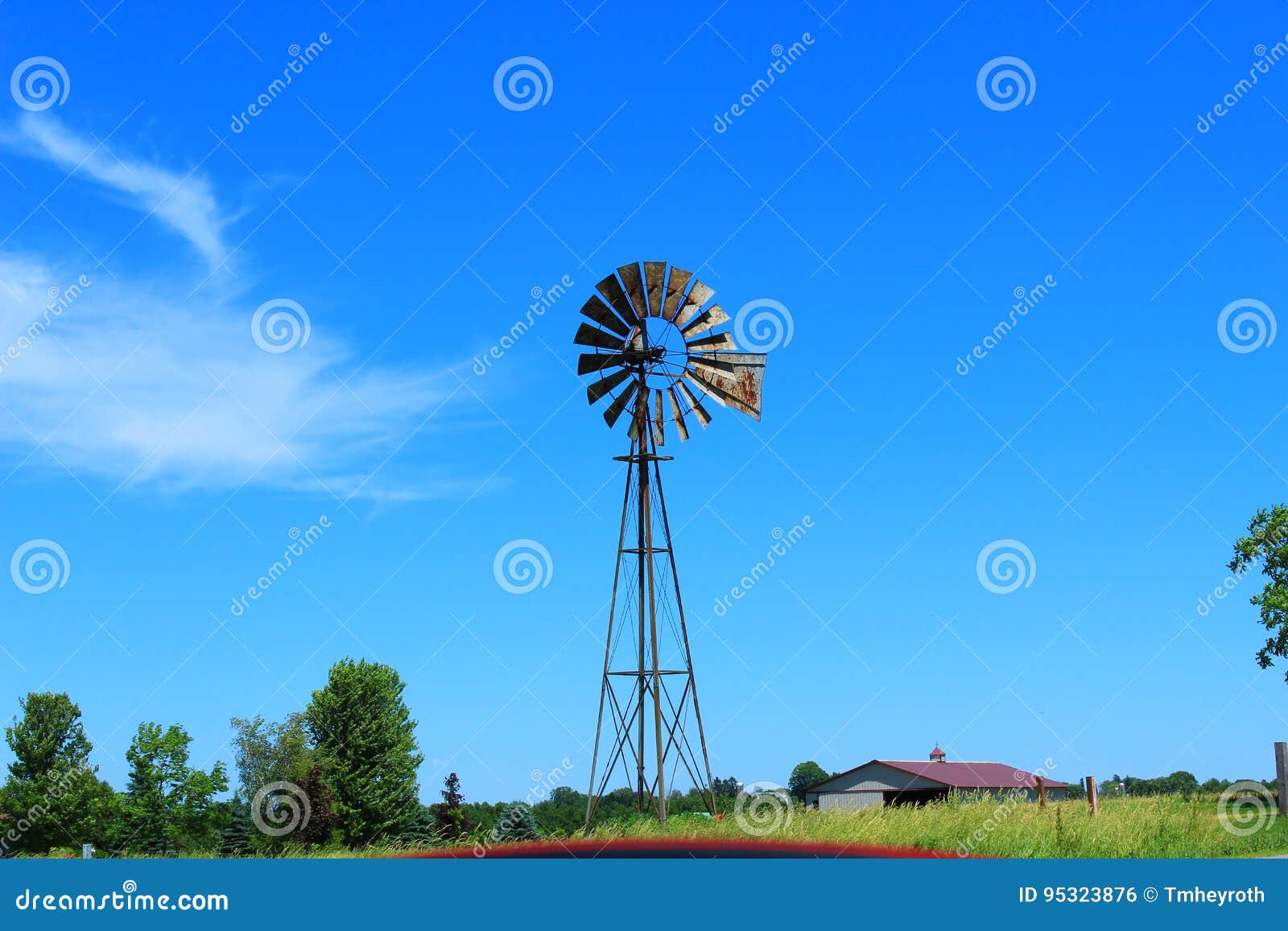 Old Farm Windmill stock photo. Image of blue, clouds - 95323876