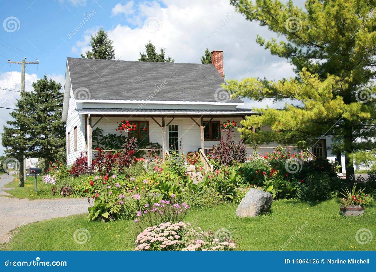 An Old Farmhouse with Flowers Stock Photo - Image of flowers ...