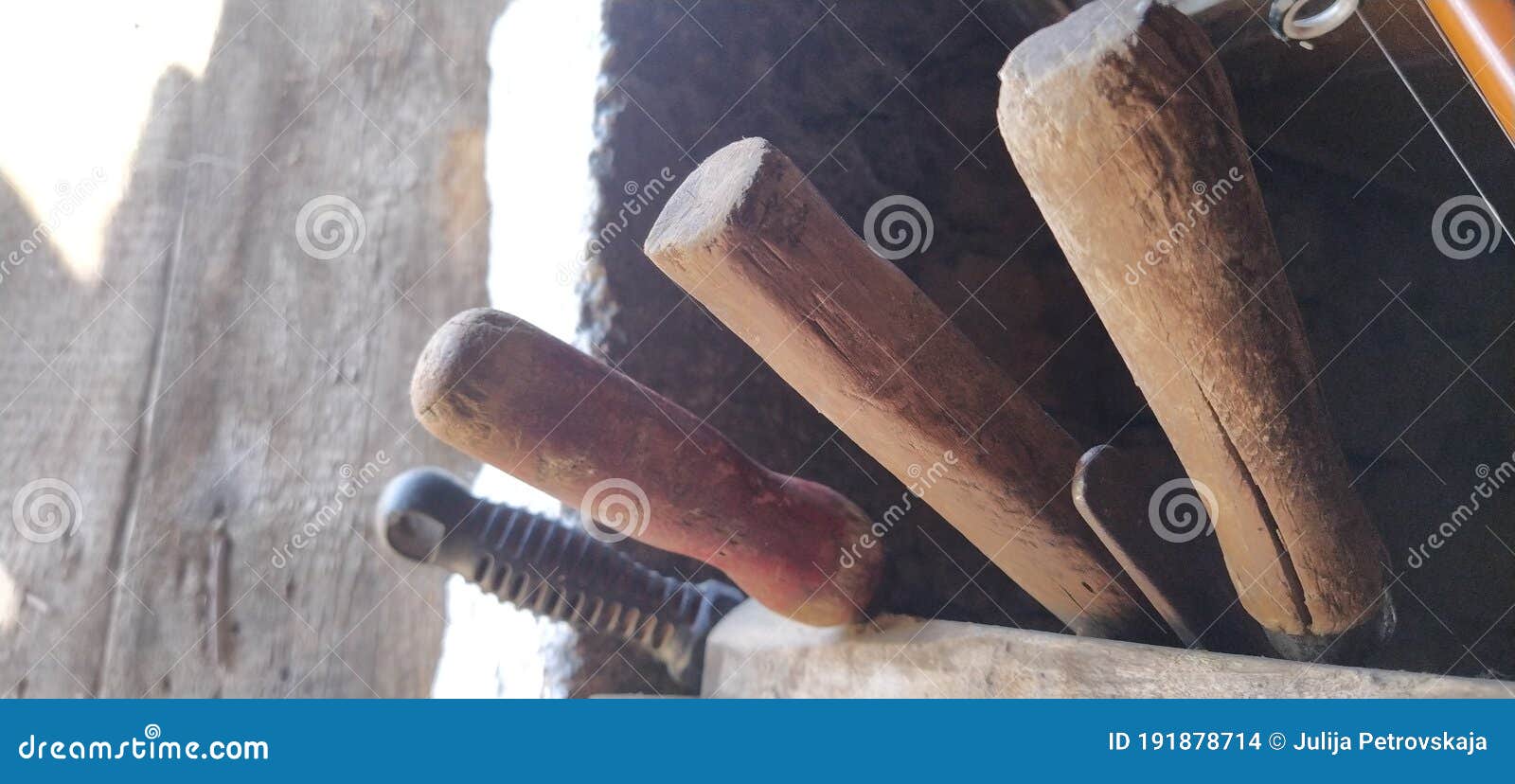 Old Farming Tools at Walls of the House. Barn Tool Handles Stock Photo ...