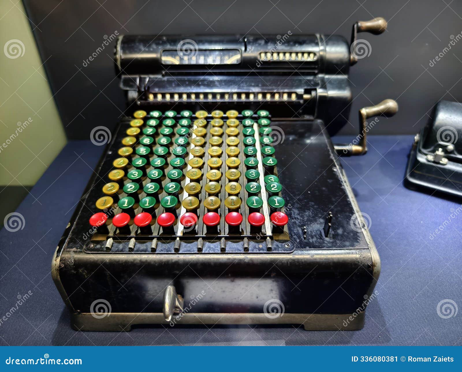 An Old Fashioned Adding Machine Features a Drawer Located Underneath it ...