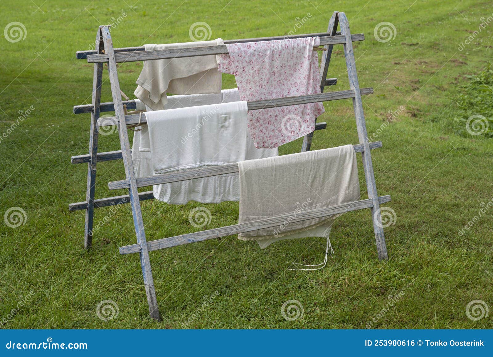 Old-fashioned Authentic Standing Wooden Laundry Rack with Clothes Stock ...