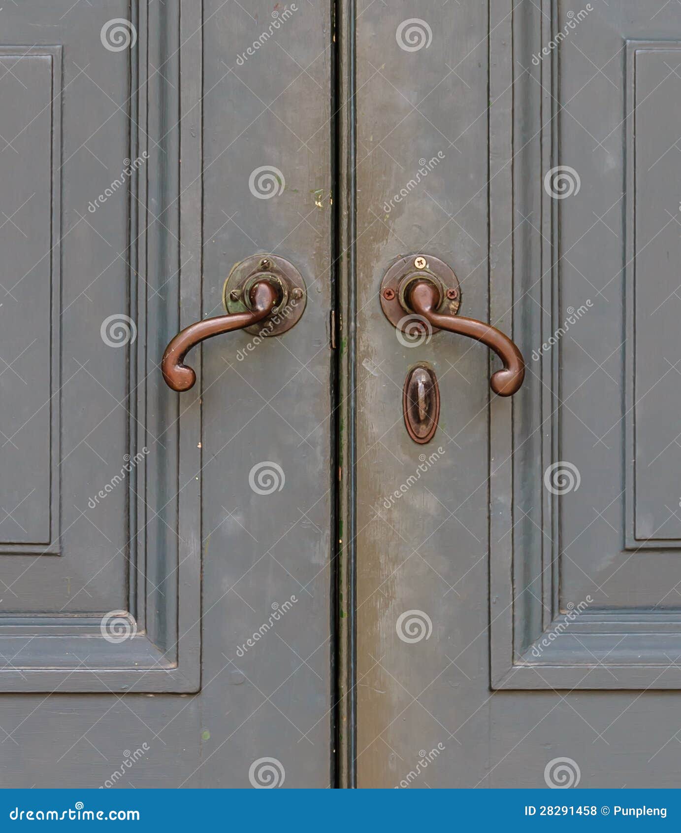Old-Fashioned Bronze Handles of Gray Door Stock Photo - Image of ...