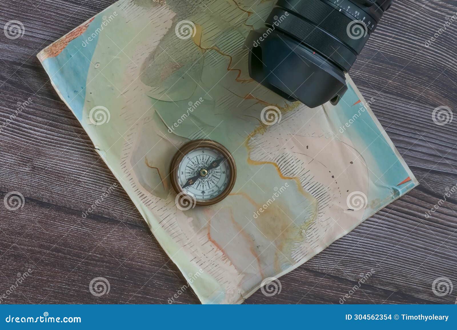 Old Fashioned Compass on a Vintage Map with Camera Stock Photo - Image ...