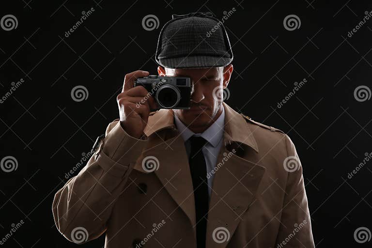 Old Fashioned Detective with Camera on Dark Background Stock Image ...