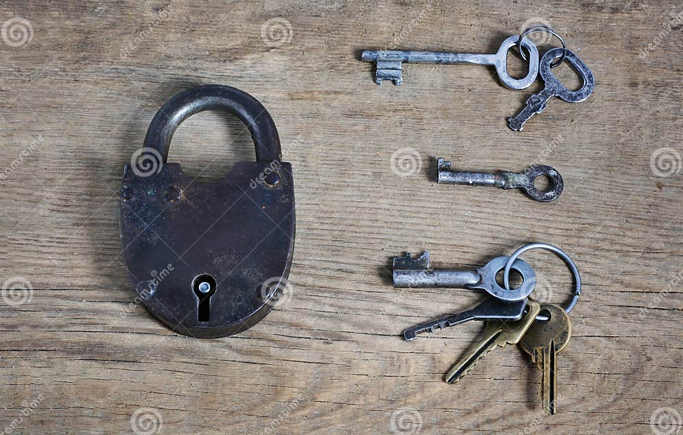 Old Fashioned Rusty Lock with Keys on Wooden Surface Stock Image ...