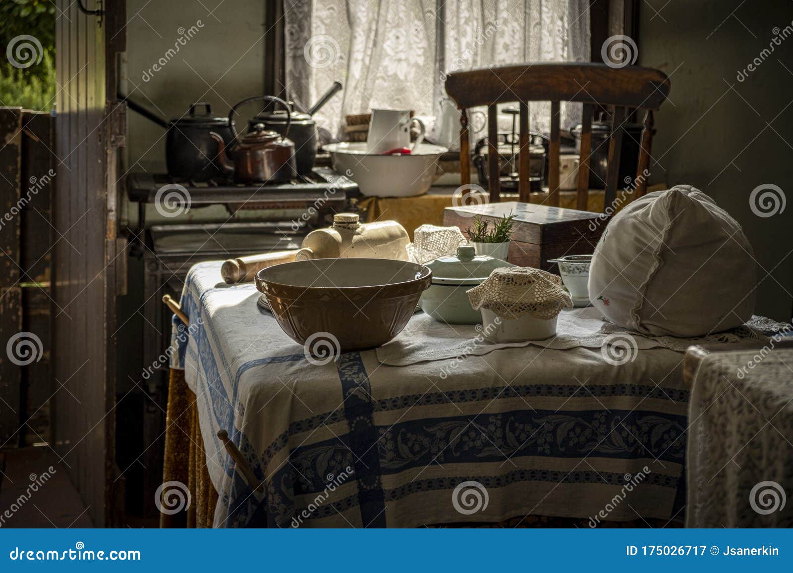 Old Fashioned Table Set for Tea with Metal Kettle and Fire in the Range ...