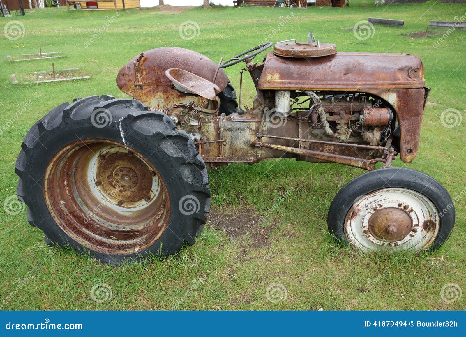 An old-fashioned tractor. stock photo. Image of obsolete - 41879494