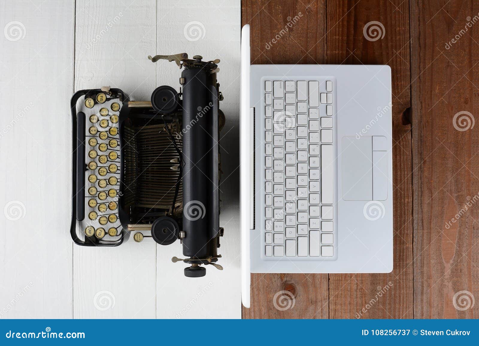 Old Fashioned Typewriter Back-to-back with a Modern Laptop Computer ...