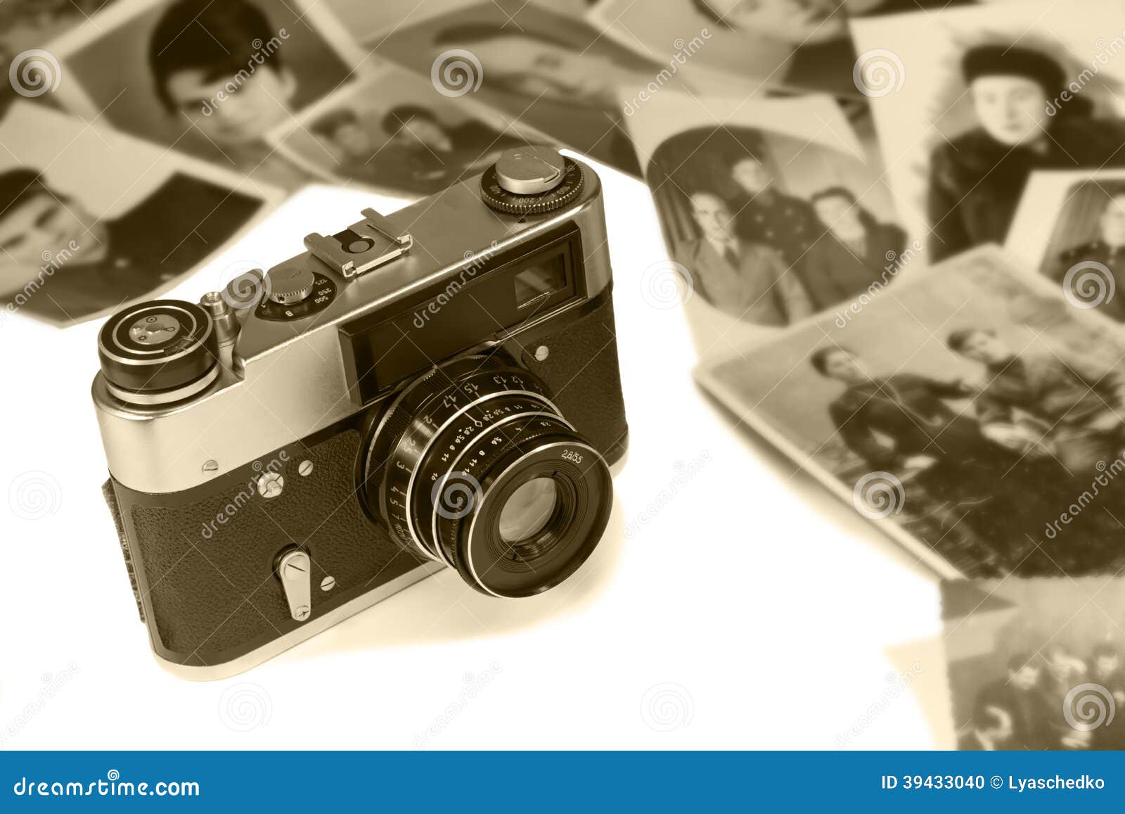 The Old Film Camera and Ancient Photos on a White Background. Stock ...