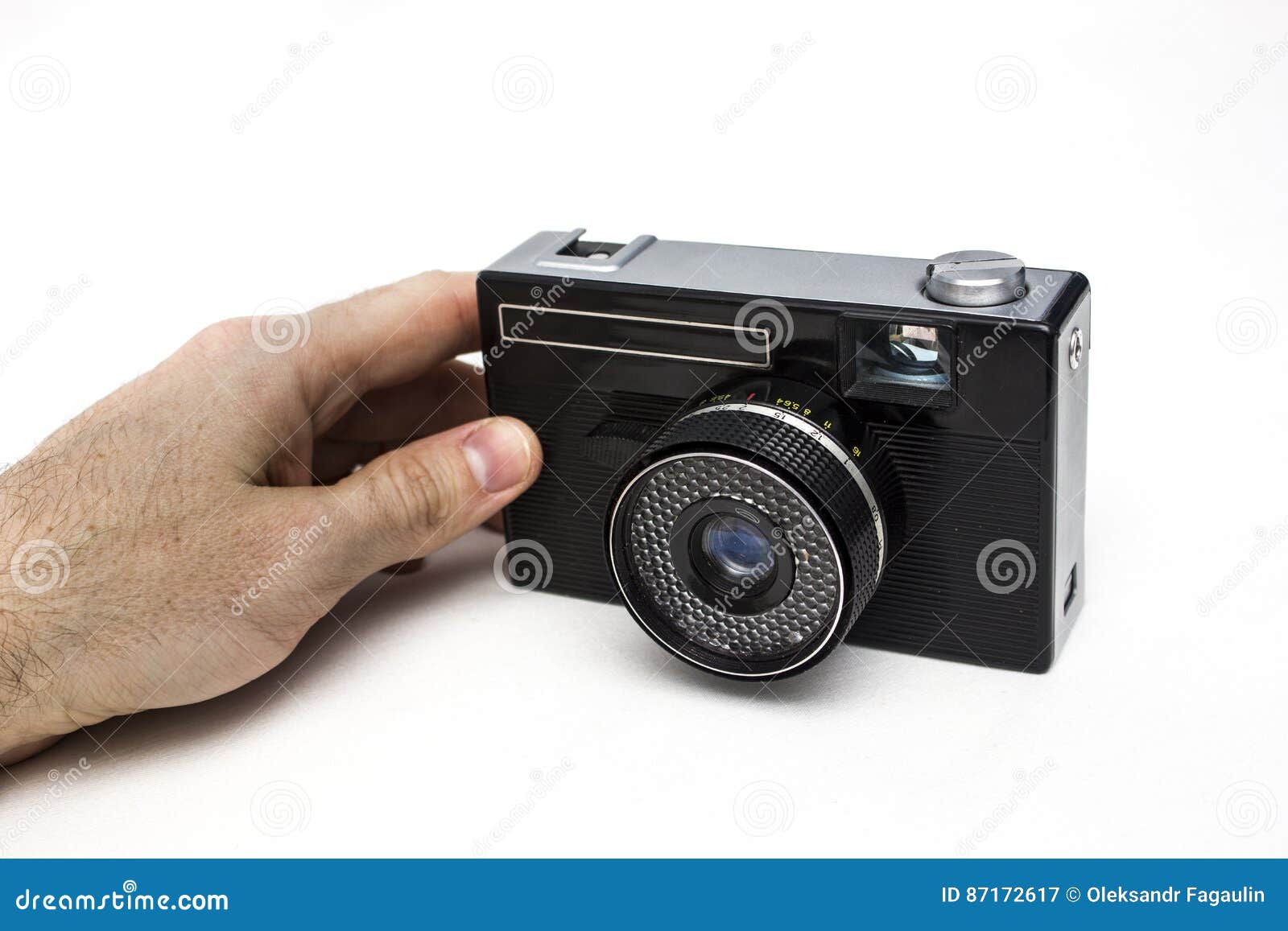 Old film camera in hands stock image. Image of background - 87172617