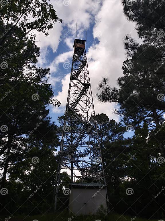 Old fire tower in clearing stock image. Image of blue - 180578603