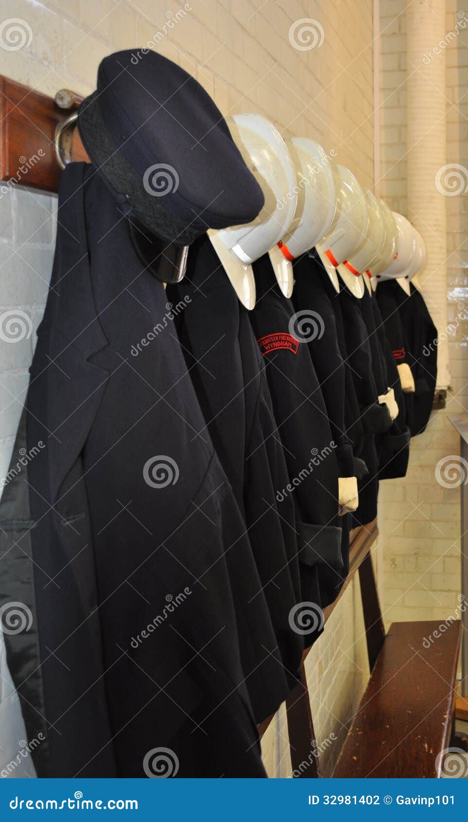 Old Fireman Uniforms with Hard Hats Stock Photo - Image of ribbon ...