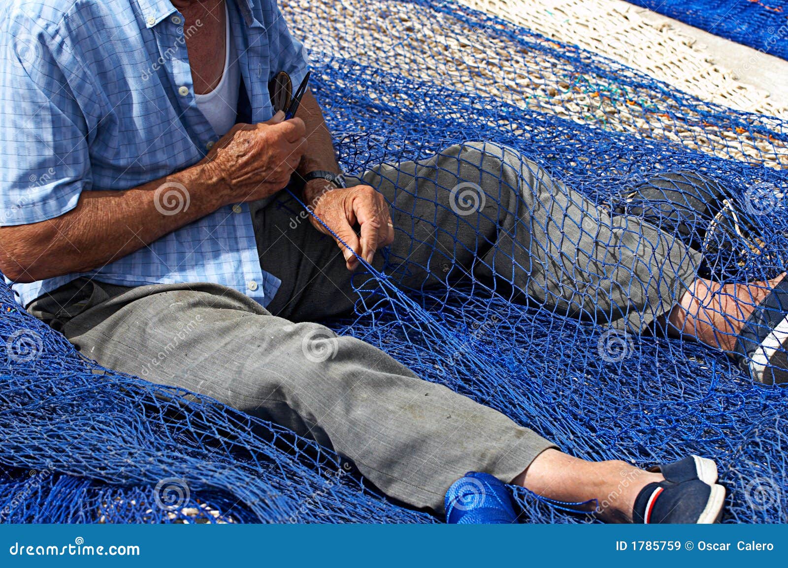 Old Fisherman Mending Nets stock image. Image of hand - 1785759