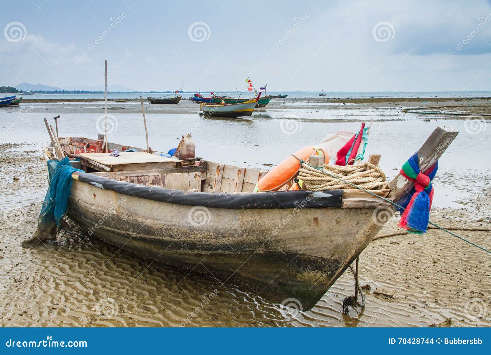 An Old Fishing Boat Moored Beached on the Beach at Low Tide. Stock ...