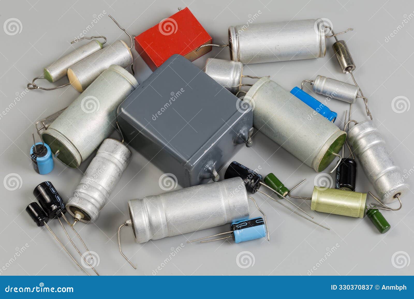 Old Fixed Common and Electrolytic Capacitors on a Gray Surface Stock ...