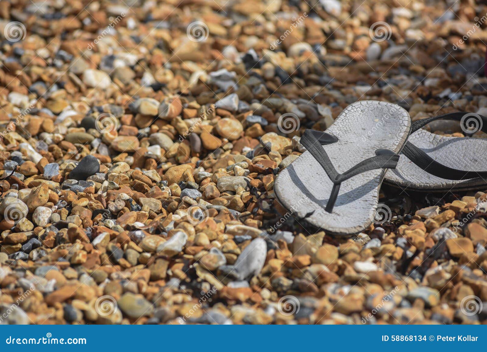 Old Flip-flops on Rocky Beach Stock Photo - Image of horizon, british ...