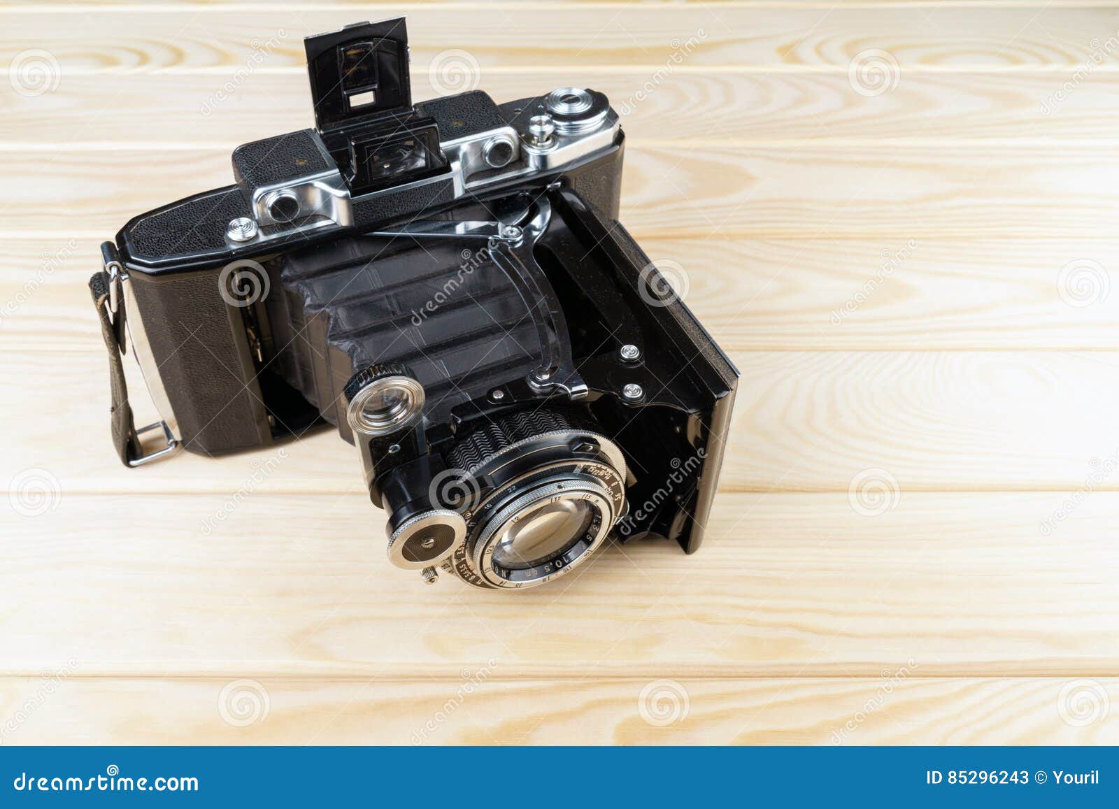 Old Folding Camera on a Textured Rustic Wooden Surface. Stock Image ...