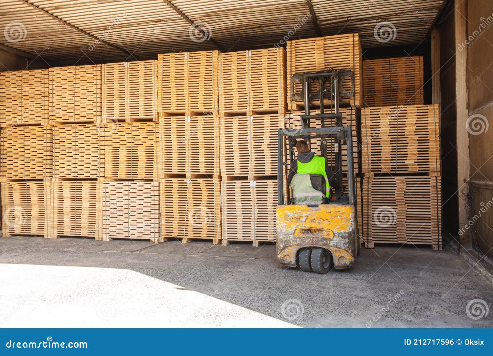 The Old Forklift Load Lumber into Dry Warehouse Stock Photo - Image of ...