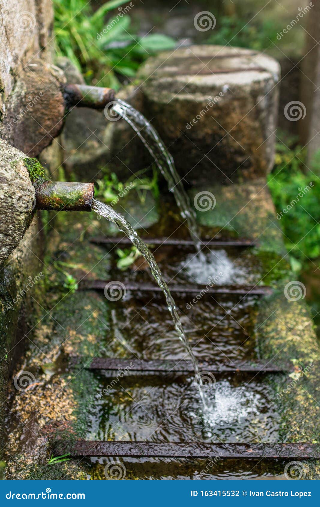 Old Fountain Poursing Water from Two Spouts Stock Photo - Image of ...