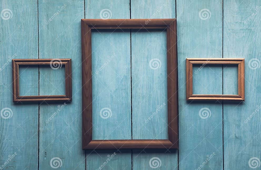 Old frames on wooden wall stock photo. Image of exhibition - 187128796