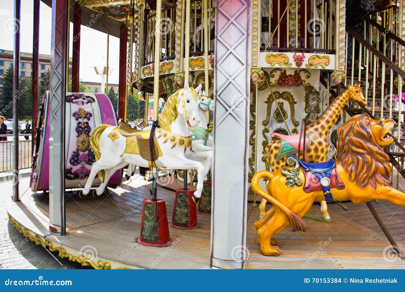 Old French Carousel In A Holiday Park. Three Horses And Airplane On A ...