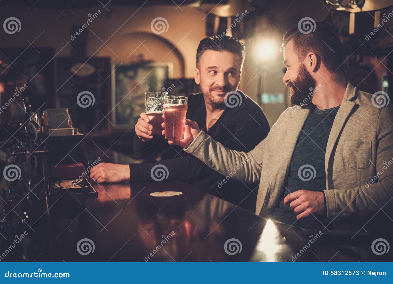 Old Friends Drinking Draft Beer at Bar Counter in Pub. Stock Image ...