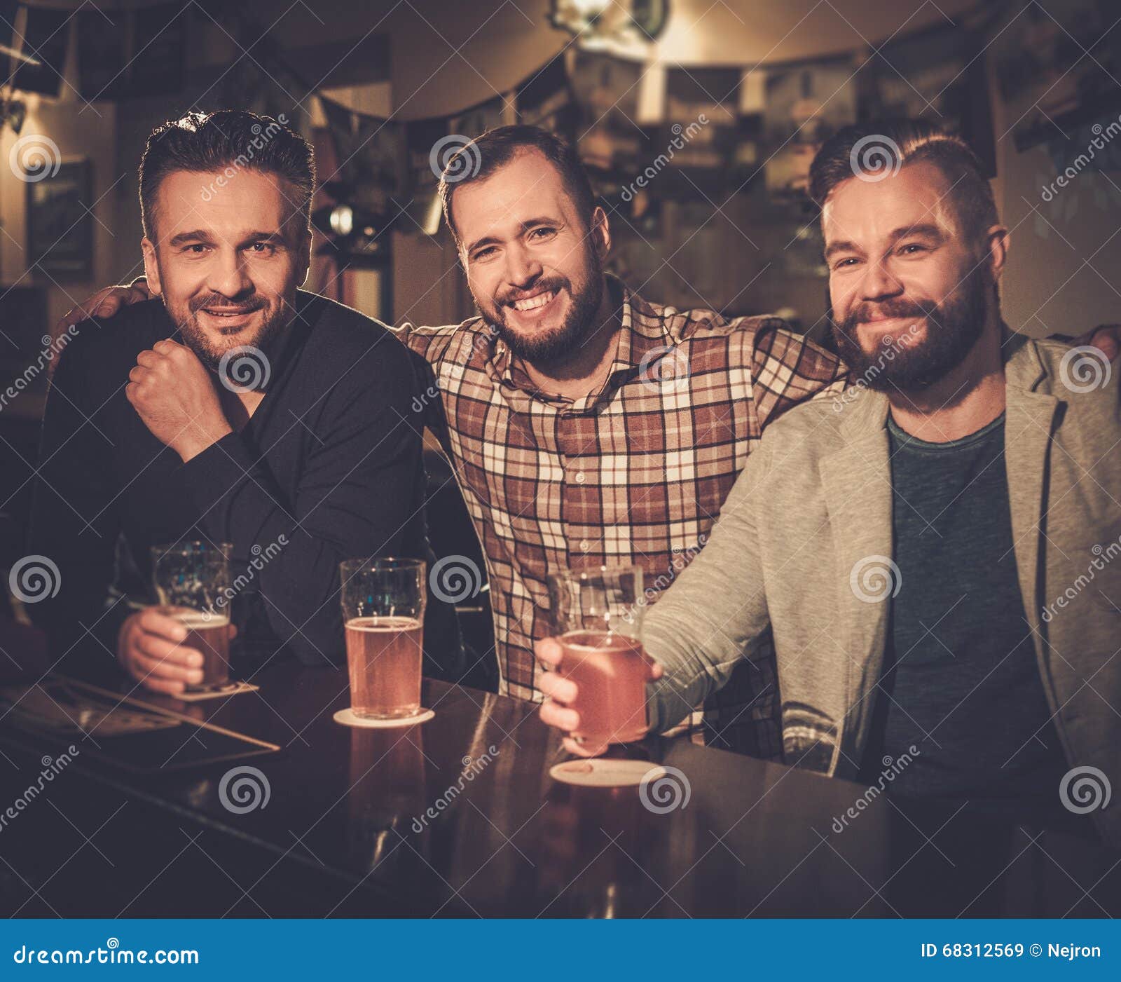 Old Friends Drinking Draft Beer at Bar Counter in Pub. Stock Image ...