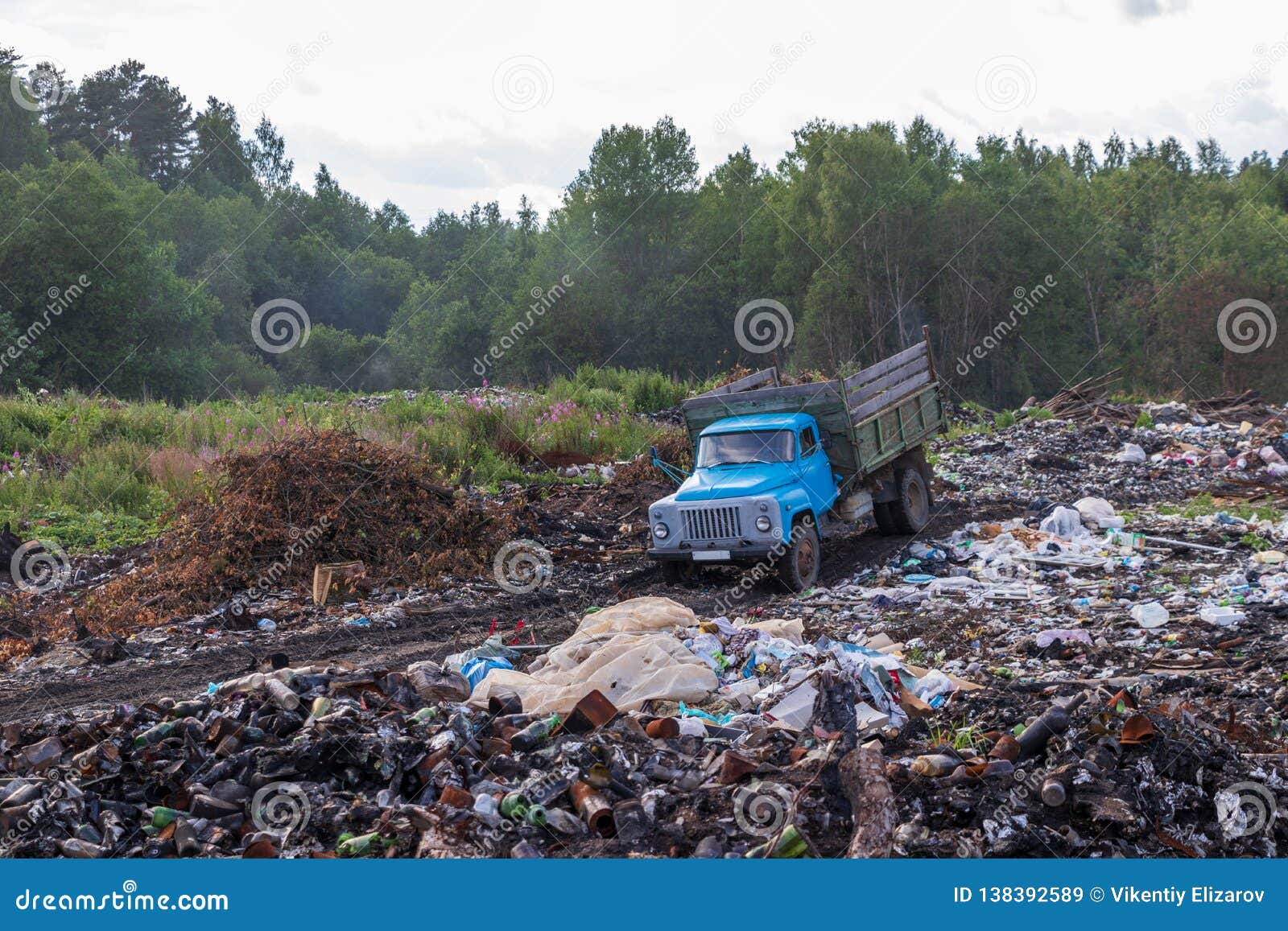 Old Garbage Truck Rides on Illegal Garbage Dump in the Woods Stock ...