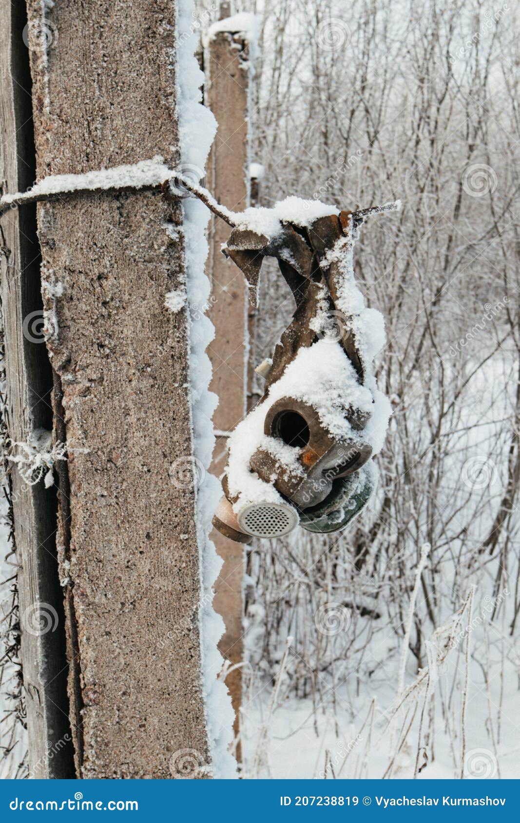 Old Gas Mask Hanging on a Pole in Winter. Snow Covered. Stock Image ...