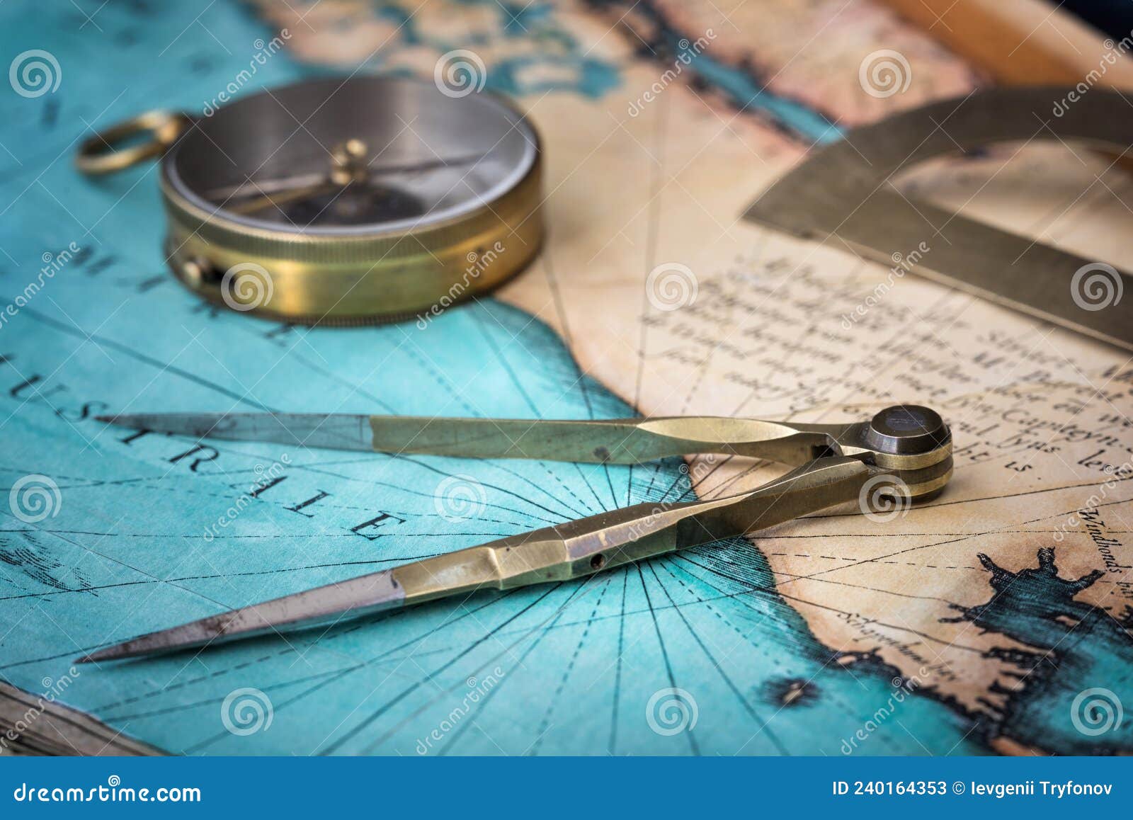 An Old Geographic Map with Navigational Tools: Compass, Divider, Ruler ...