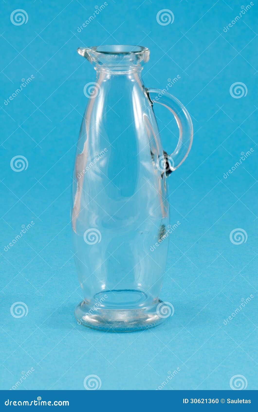 Old Glass Jug Jar Pitcher Handle on Blue Stock Photo - Image of ...