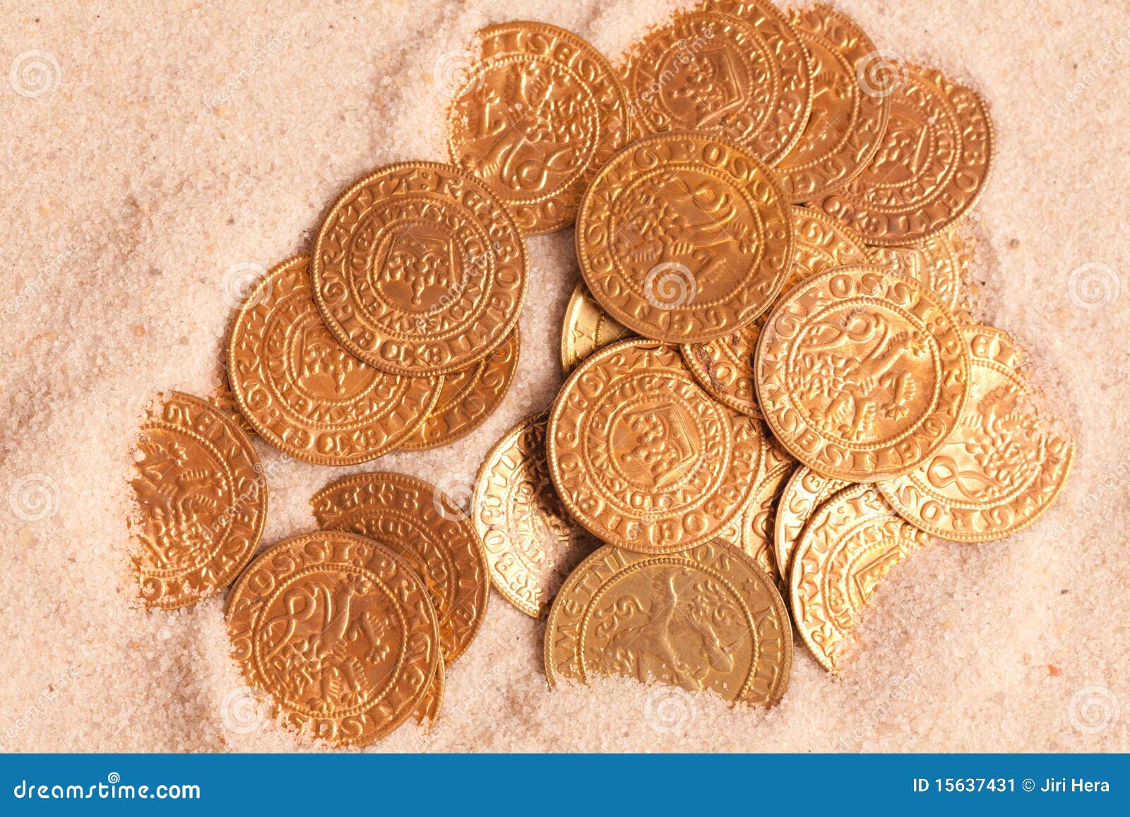 Old golden coins in sand stock image. Image of financial - 15637431