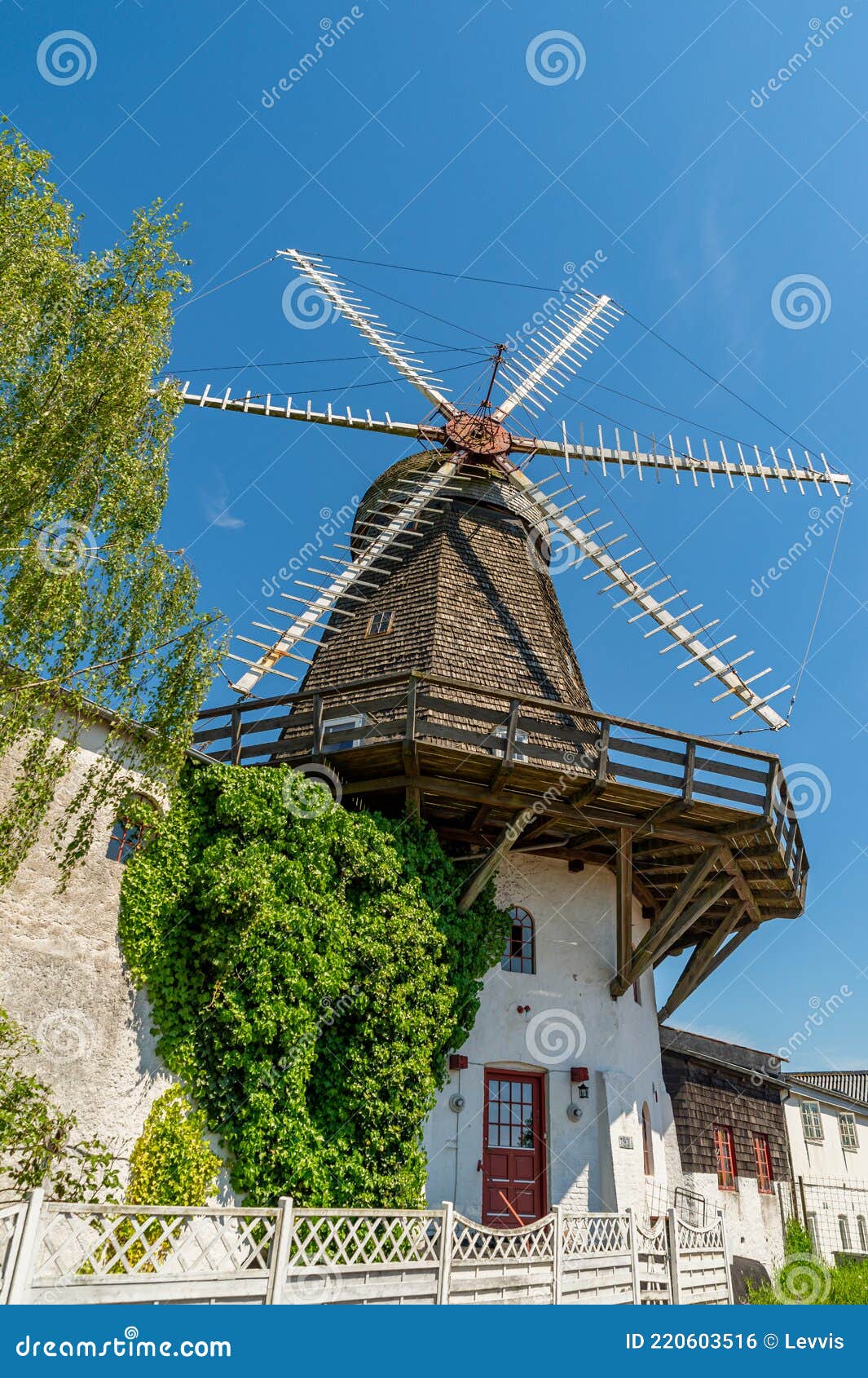 Old grain mill in Denmark stock photo. Image of bridge - 220603516
