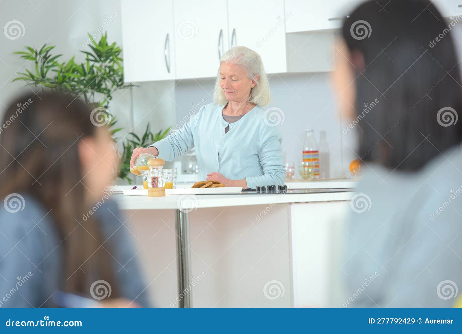 Old grandma in kitchen stock image. Image of senior - 277792429