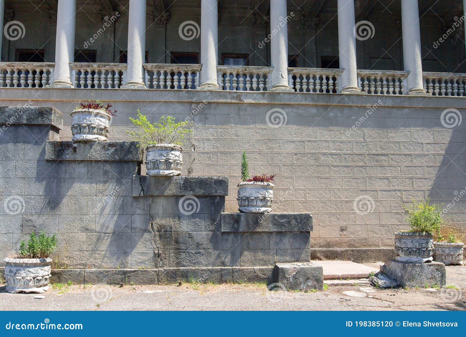 Old Grey Stone Building with Stairs, Decorative Vases and Columns in ...