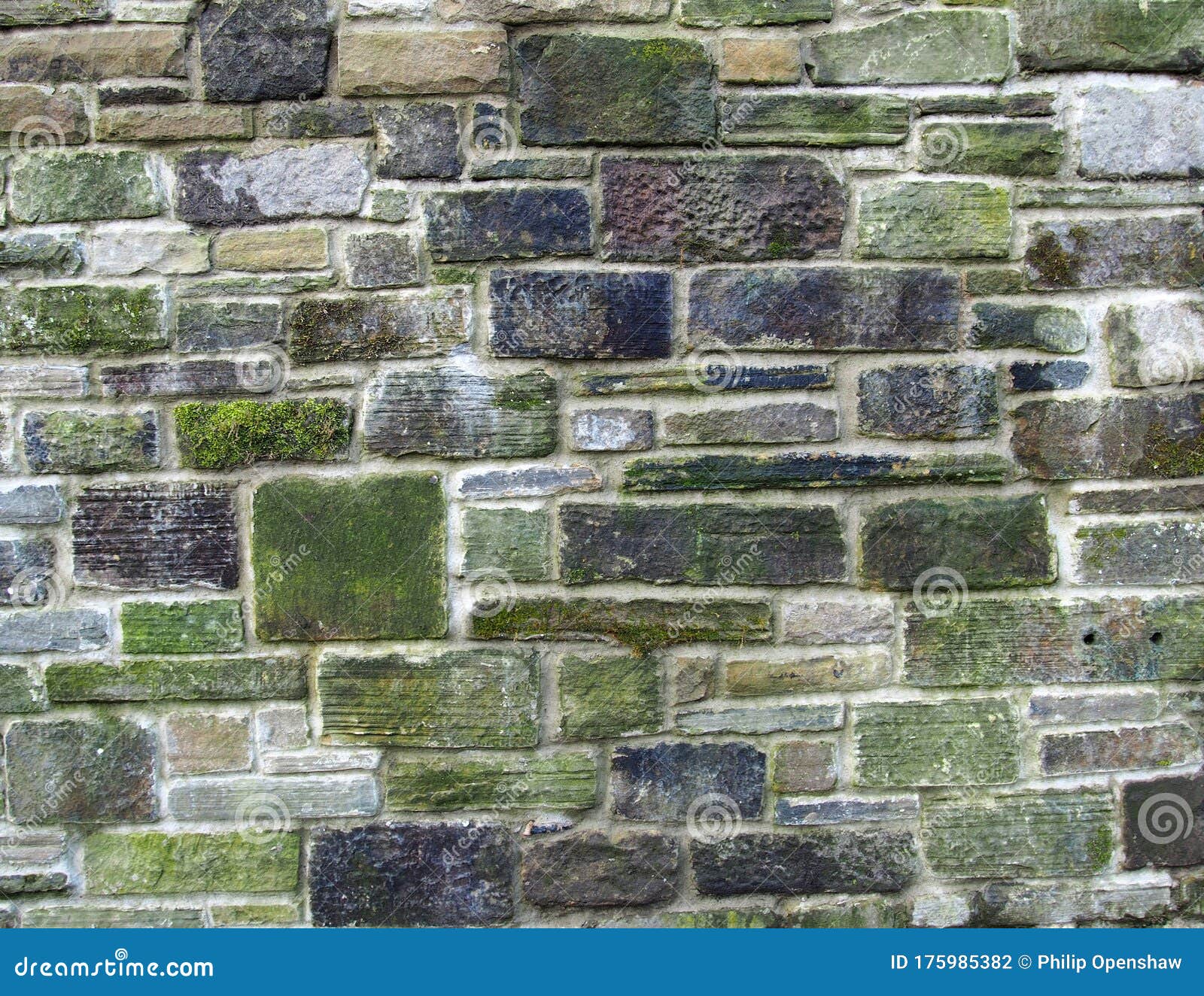 Old Grey Stone Wall Made of Large Irregular Blocks Covered in Patches ...