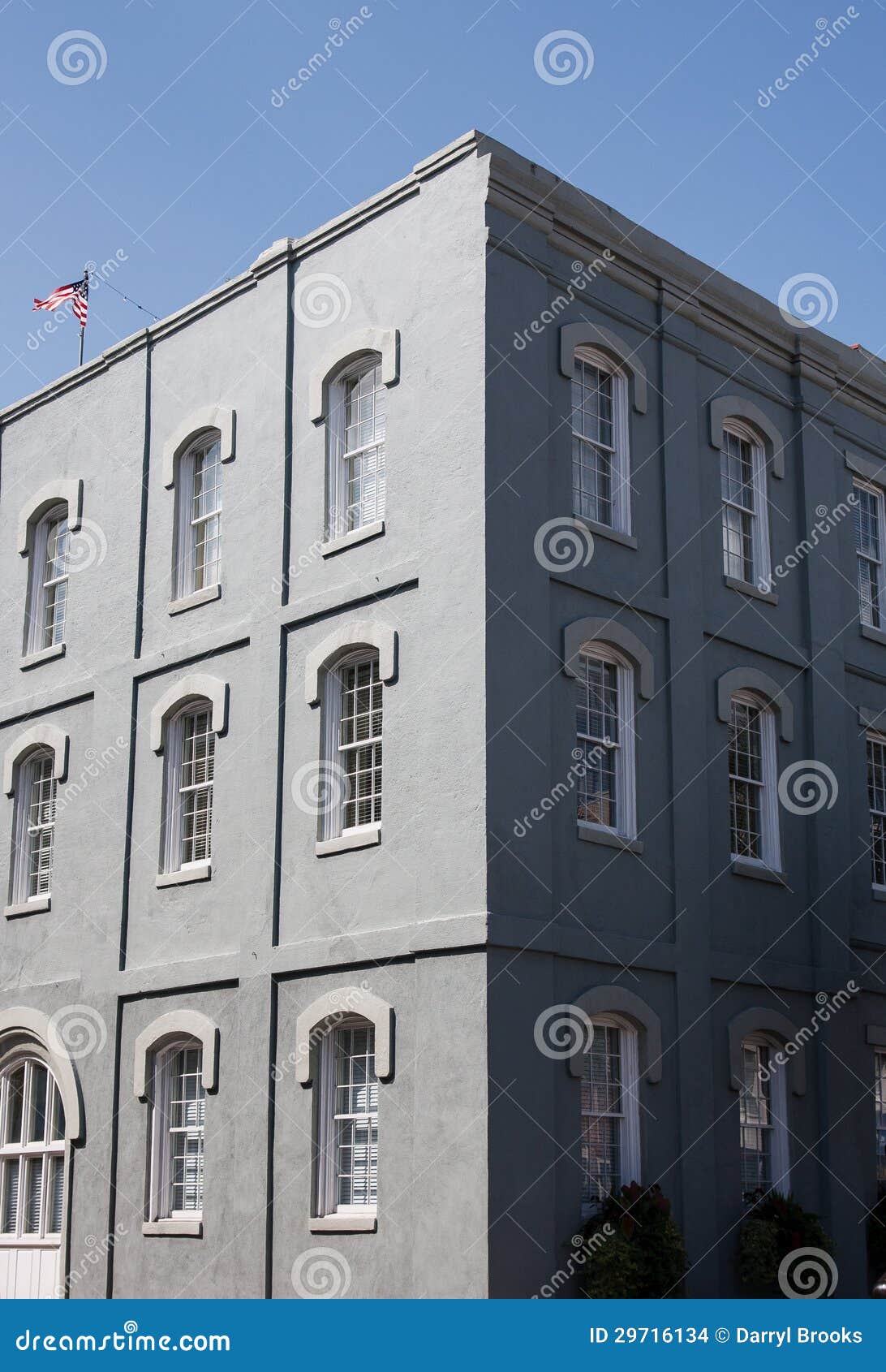 Grey Stucco Building with White Windows Stock Photo - Image of ...