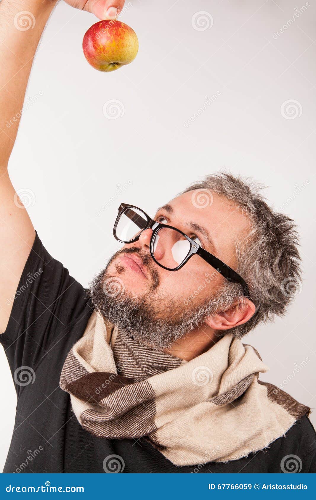 Old Grumpy Man with Beard and Big Nerd Glasses and an Apple Stock Image ...