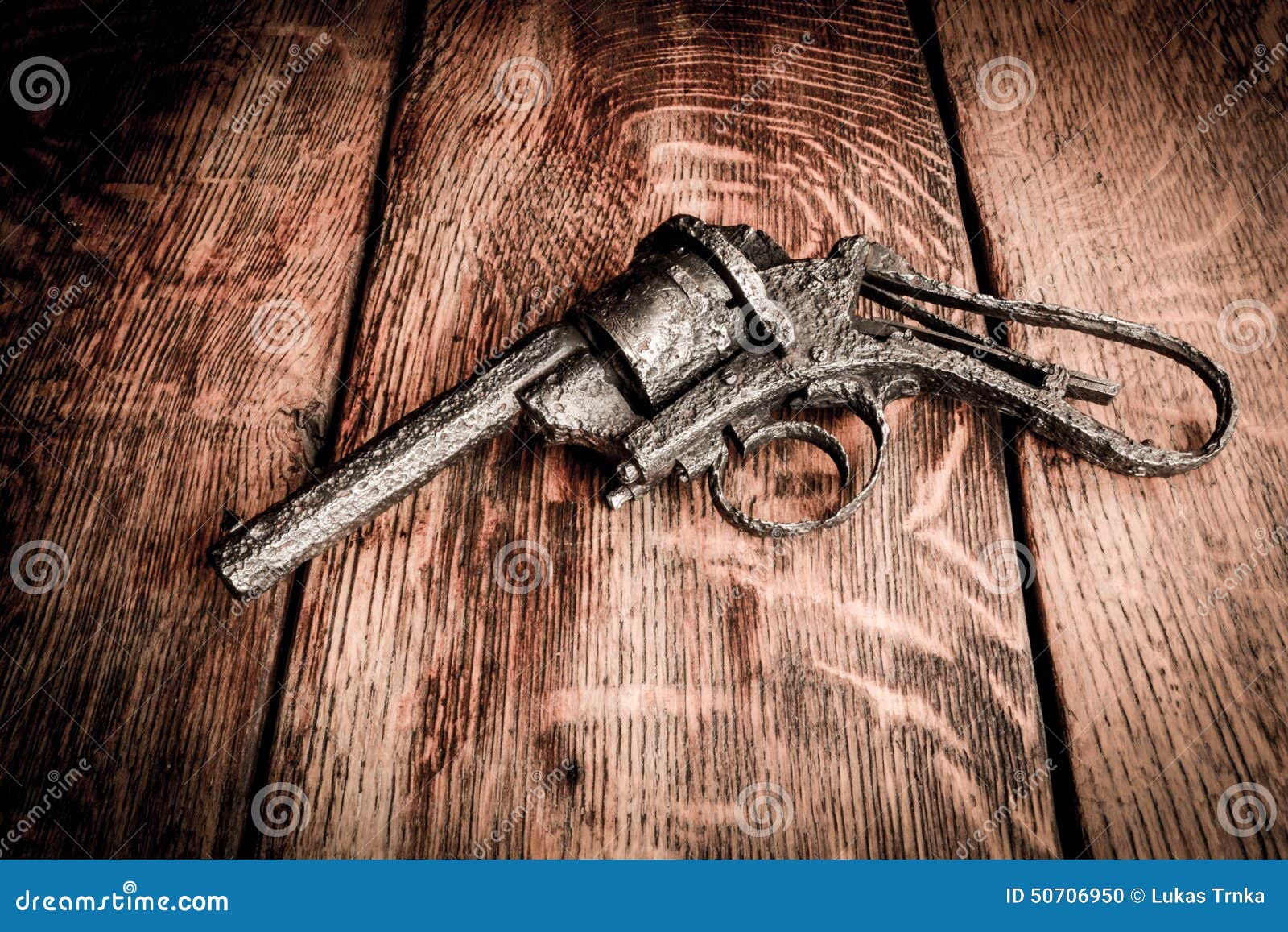 Old gun on wooden table stock photo. Image of weapon - 50706950