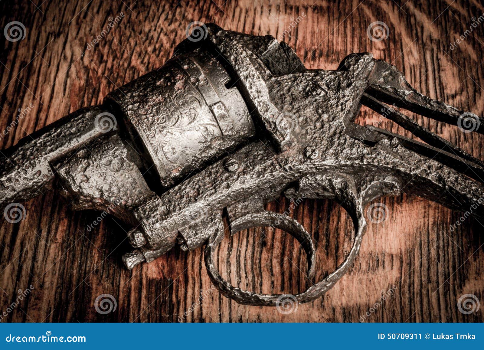 Old gun on wooden table stock image. Image of weapon - 50709311