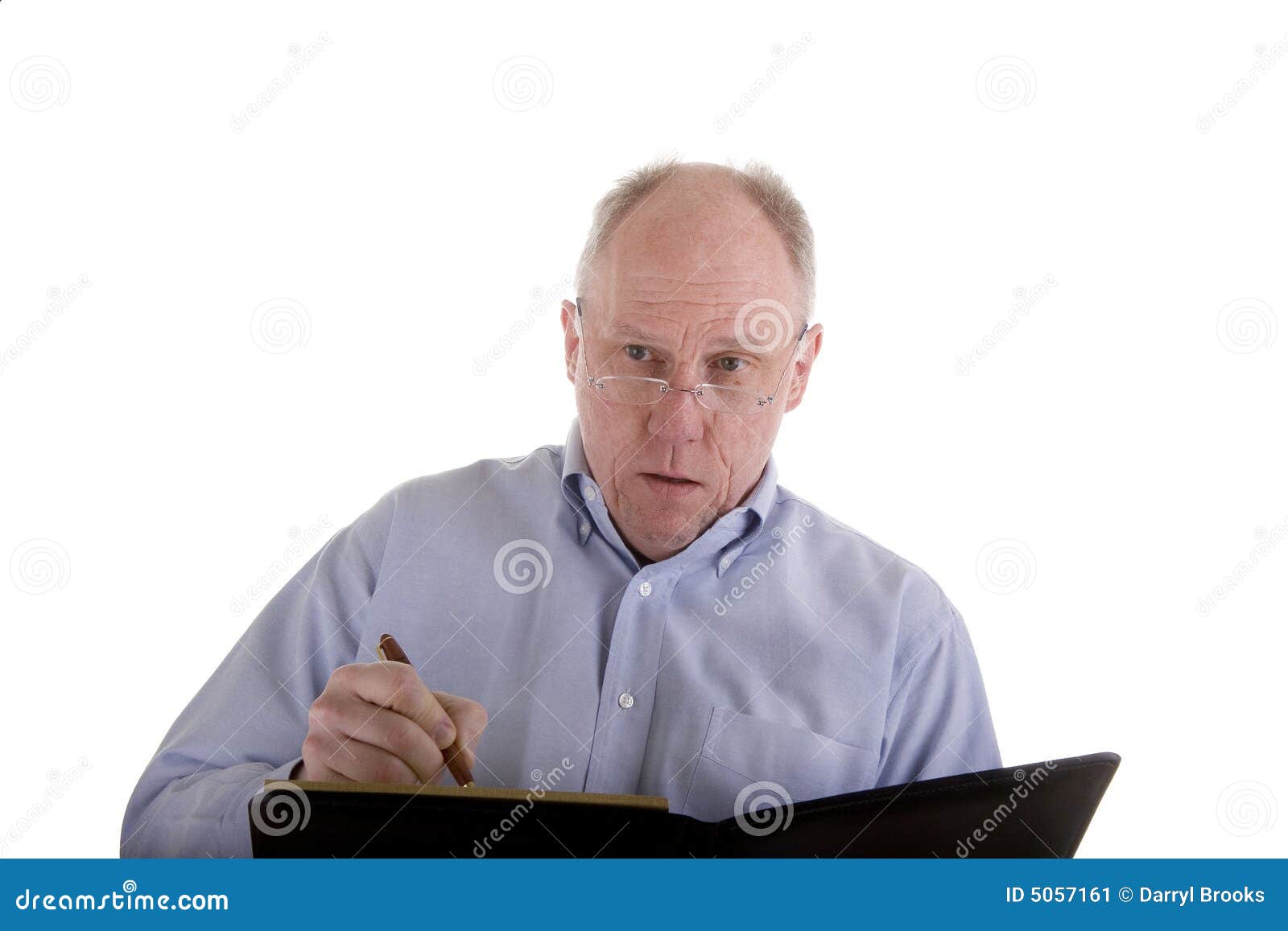 Old Guy In Blue Shirt Taking Notes Picture. Image: 5057161