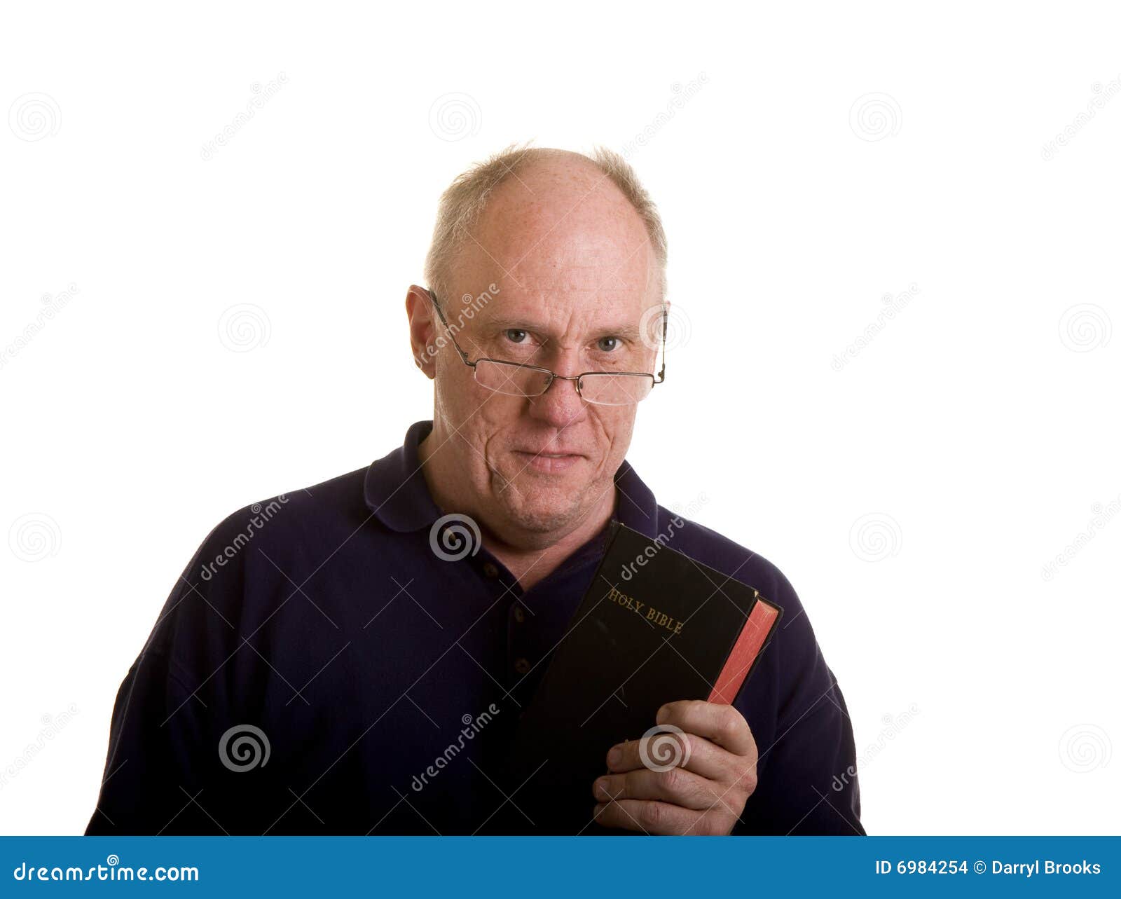 Old Guy Looking Over Glasses with Bible Stock Photo - Image of ...