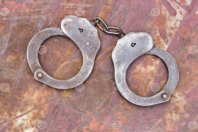 Old Handcuffs on the Table. Old Rusty Metal Stock Photo - Image of lock ...