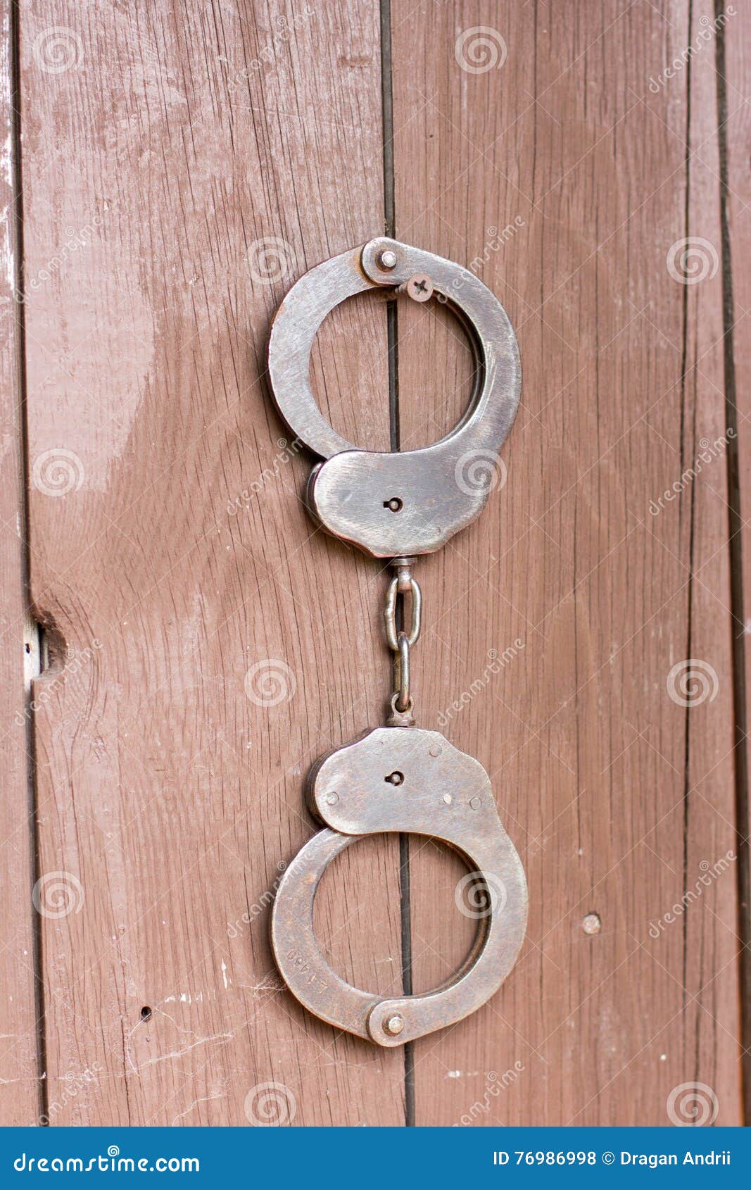 Old Handcuffs on the Wall. Old Wooden Boards Stock Photo - Image of ...