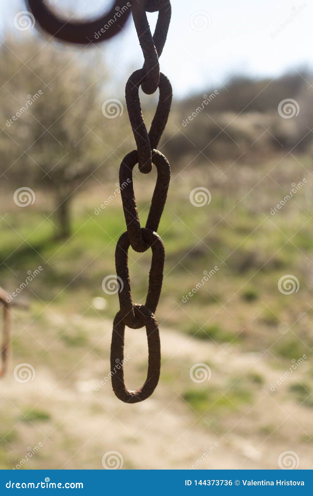 Old hanging rusty chain. stock photo. Image of metallic - 144373736