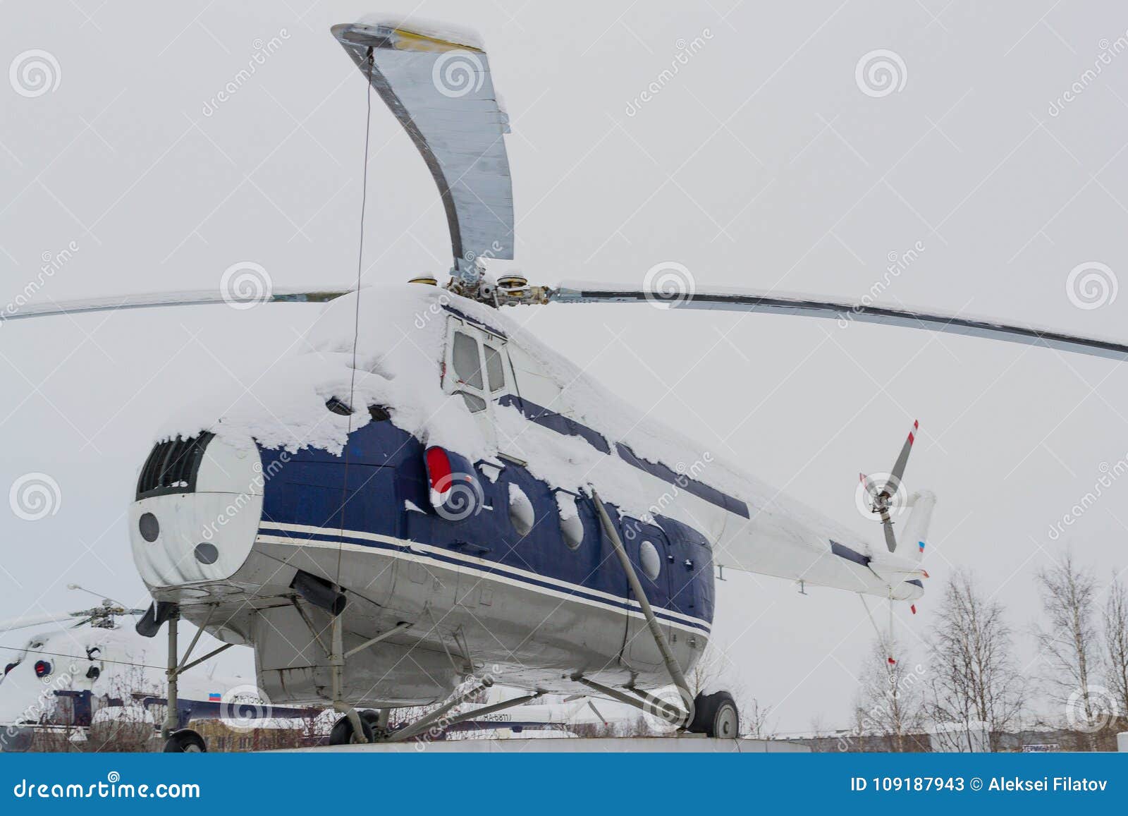 Old helicopter in winter stock image. Image of tree - 109187943