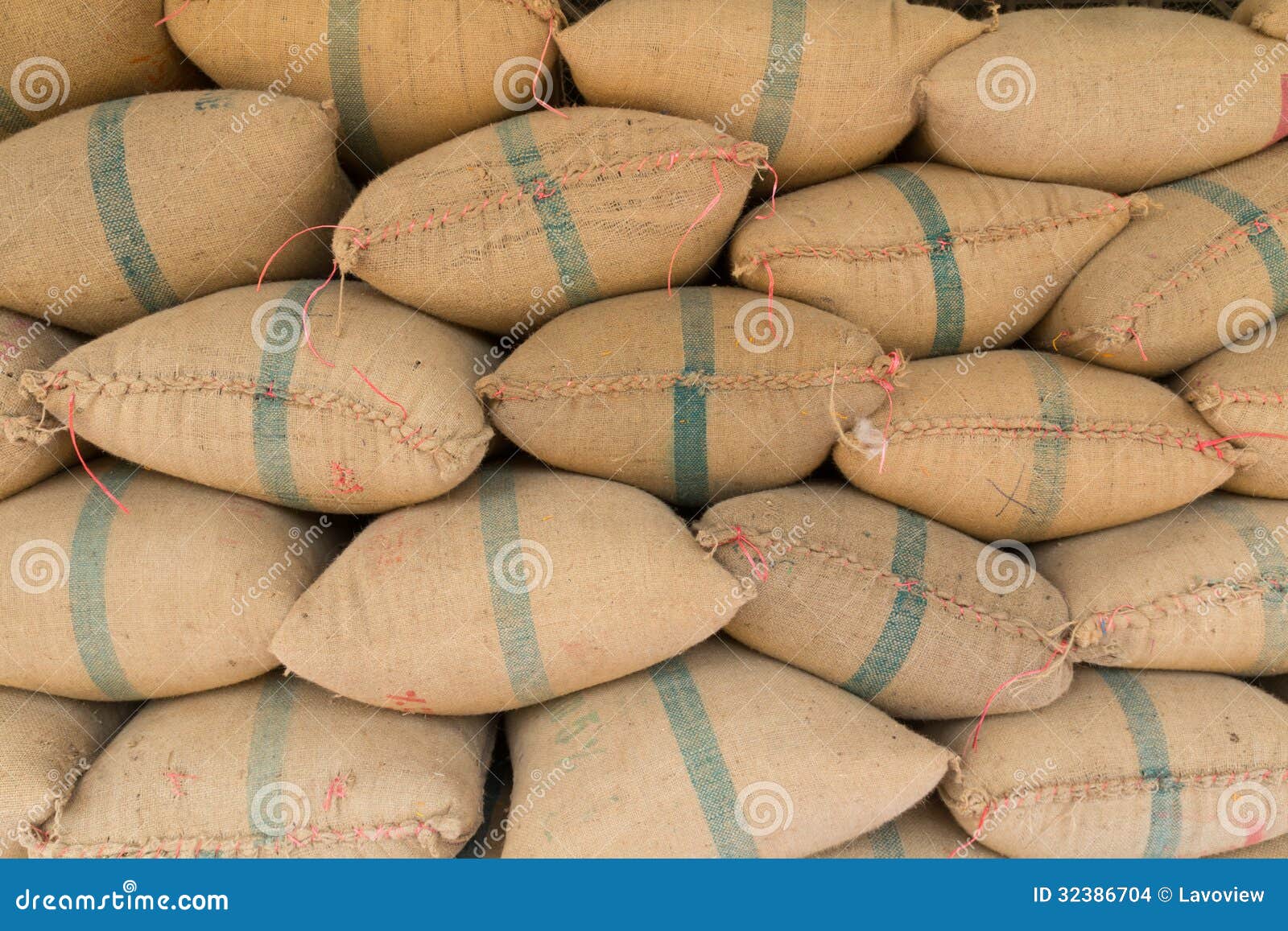 Sacks Of Rice Are Placed In Straight Rows On Wooden Pallets Royalty ...