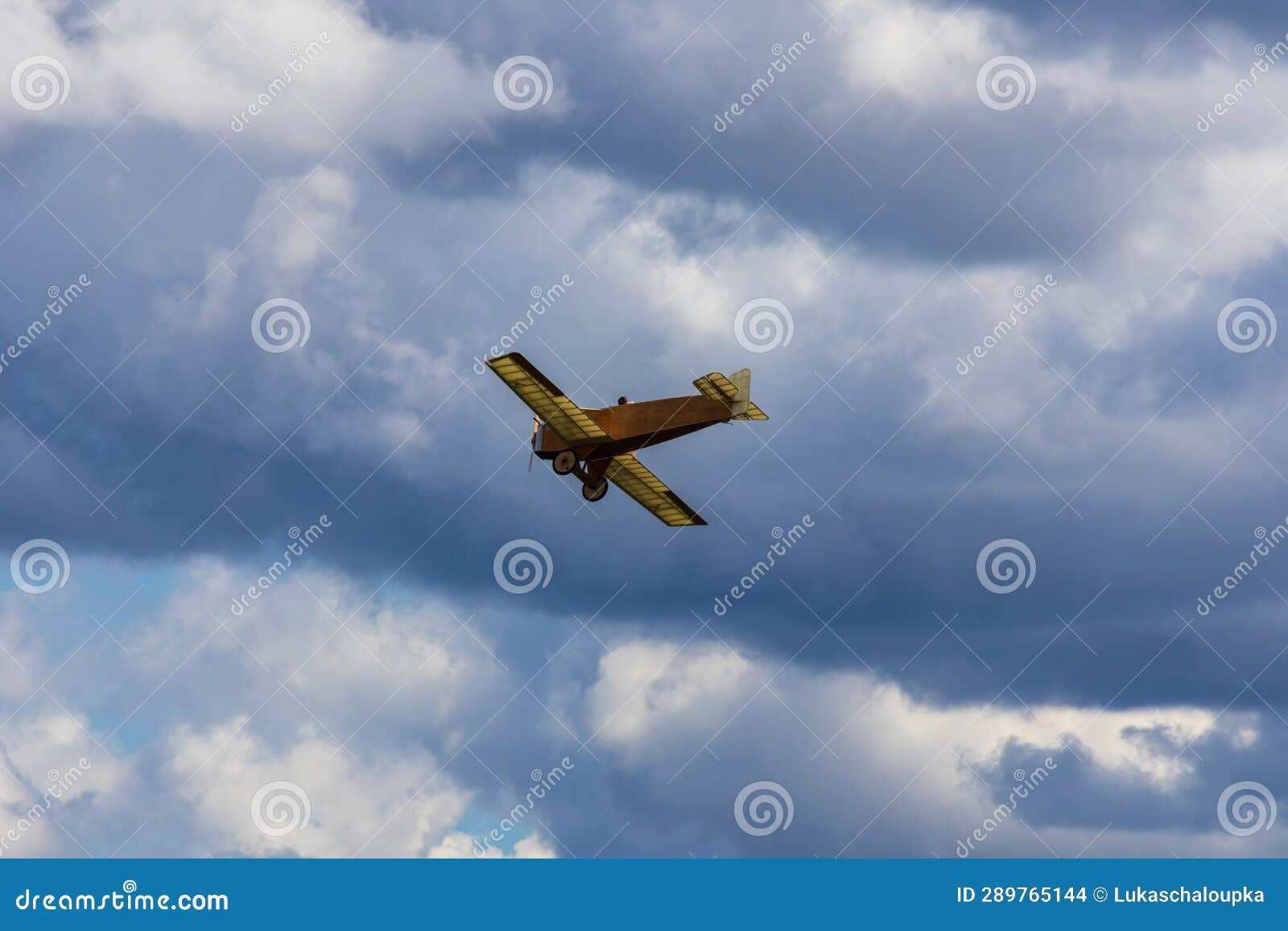 Old Historic Biplane Fly on Cloudy Sky from Side Stock Photo - Image of ...