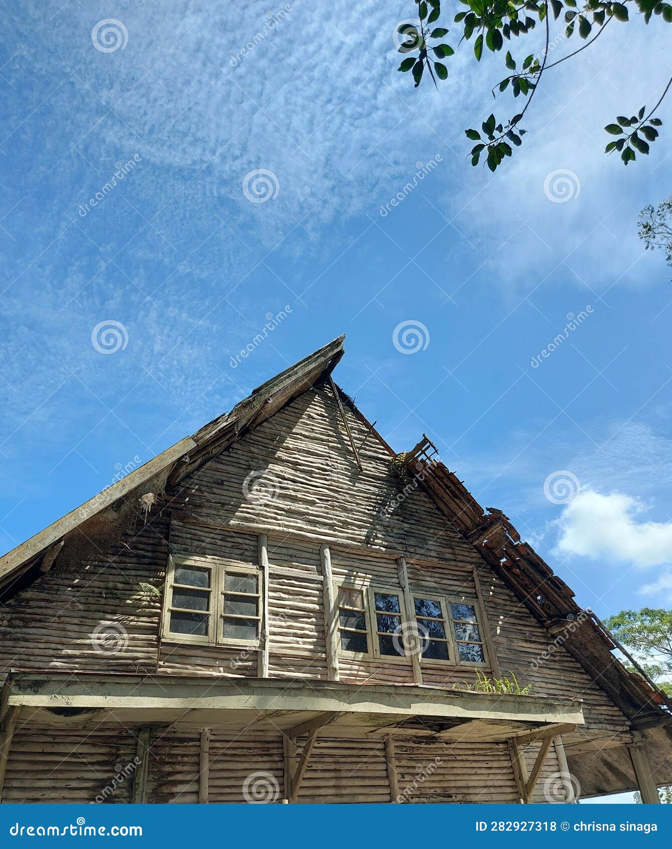 An Old House Whose Roof Has Begun To Crumble Stock Photo - Image of ...